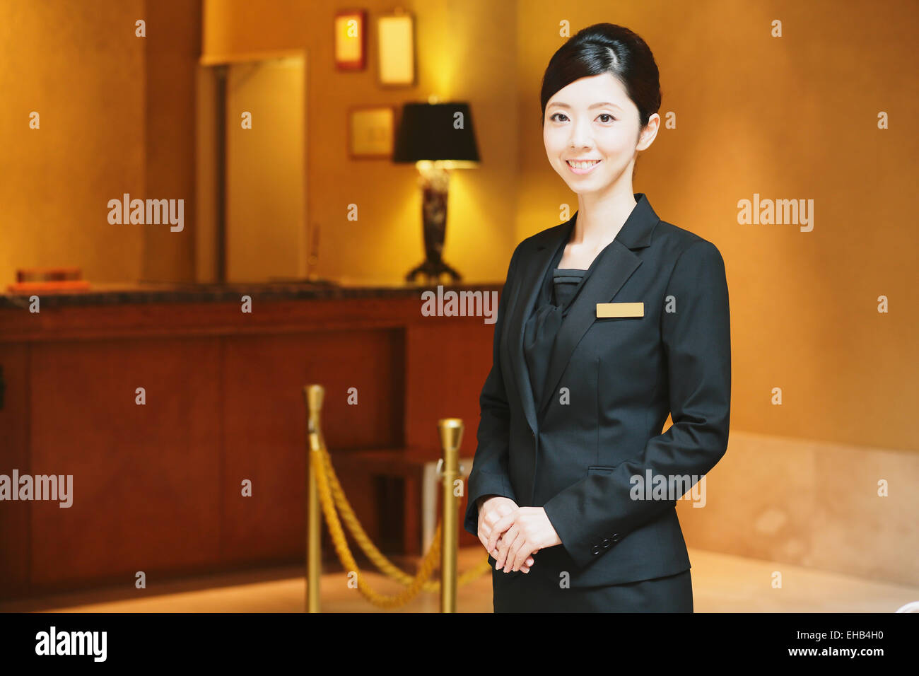 Japanese female hotel concierge Stock Photo - Alamy