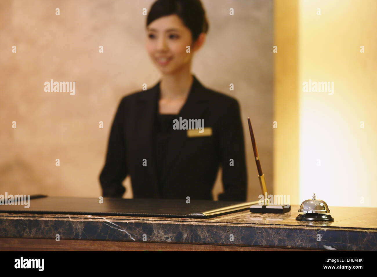 Japanese female hotel concierge Stock Photo - Alamy