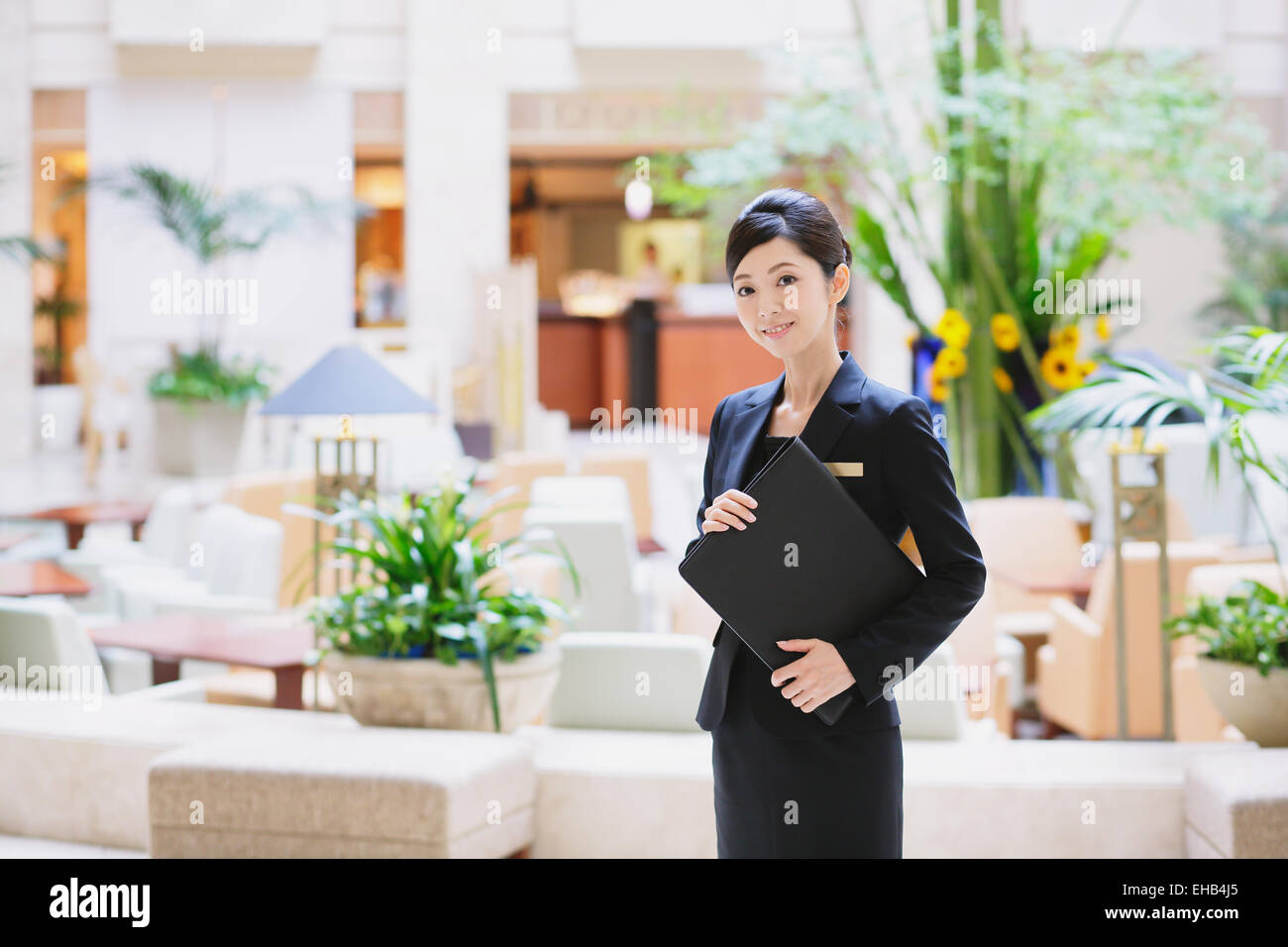 Japanese female hotel concierge Stock Photo - Alamy