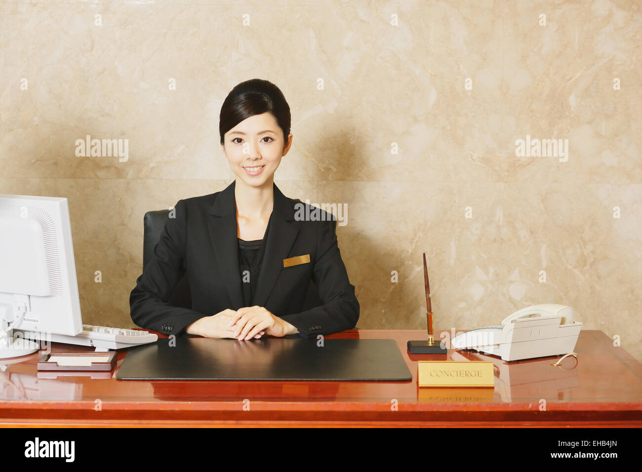 Japanese female hotel concierge Stock Photo - Alamy