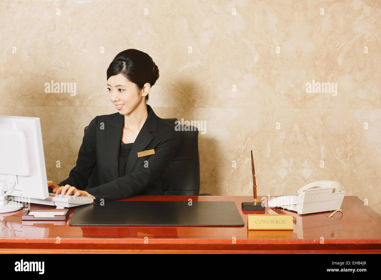 Japanese female hotel concierge Stock Photo - Alamy
