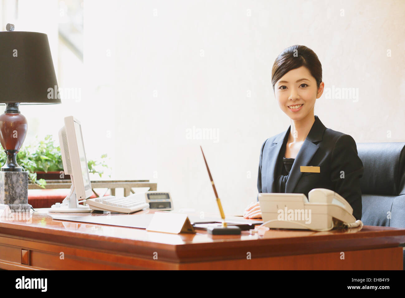 Japanese female hotel concierge Stock Photo - Alamy
