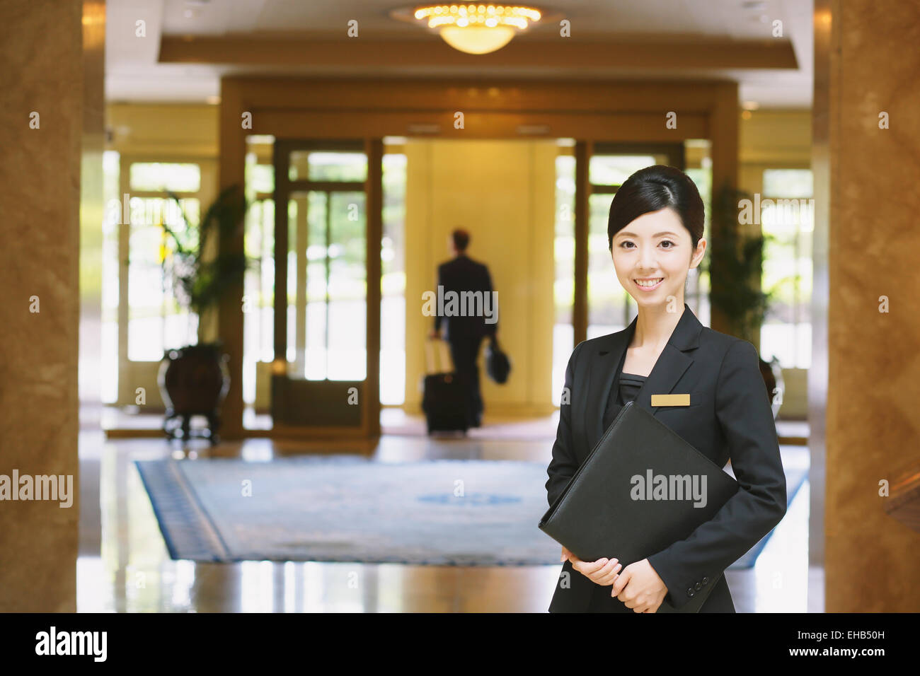Japanese female hotel concierge Stock Photo - Alamy