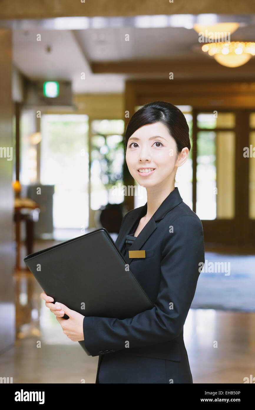 Japanese female hotel concierge Stock Photo - Alamy