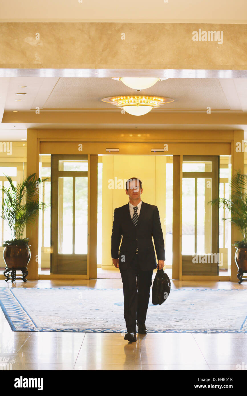 Businessman arriving at the hotel Stock Photo - Alamy
