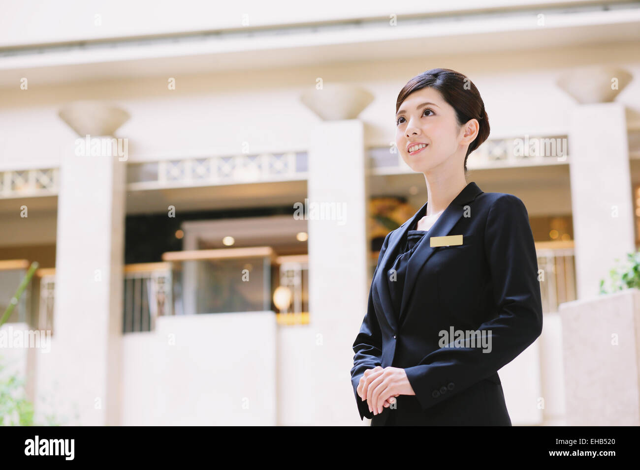 Japanese female hotel concierge Stock Photo - Alamy