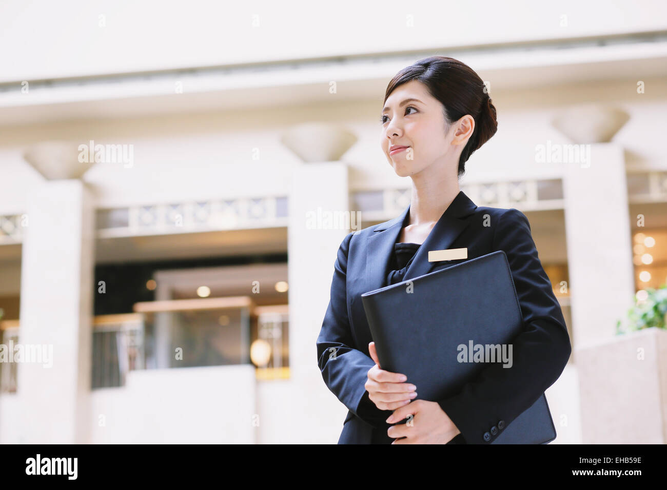 Japanese female hotel concierge Stock Photo - Alamy