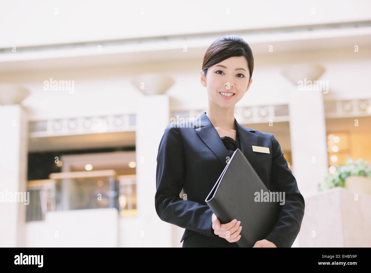 Japanese female hotel concierge Stock Photo - Alamy