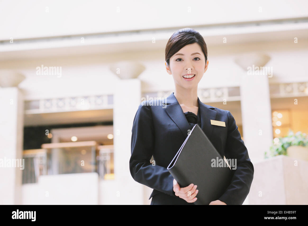 Japanese female hotel concierge Stock Photo - Alamy