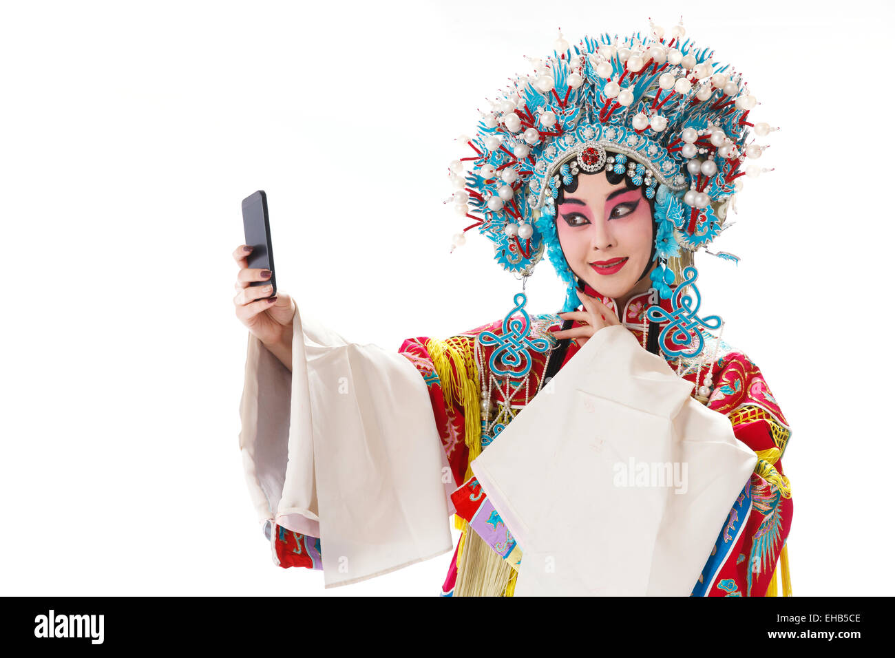 Female Peking Opera performers with mobile phones Stock Photo - Alamy
