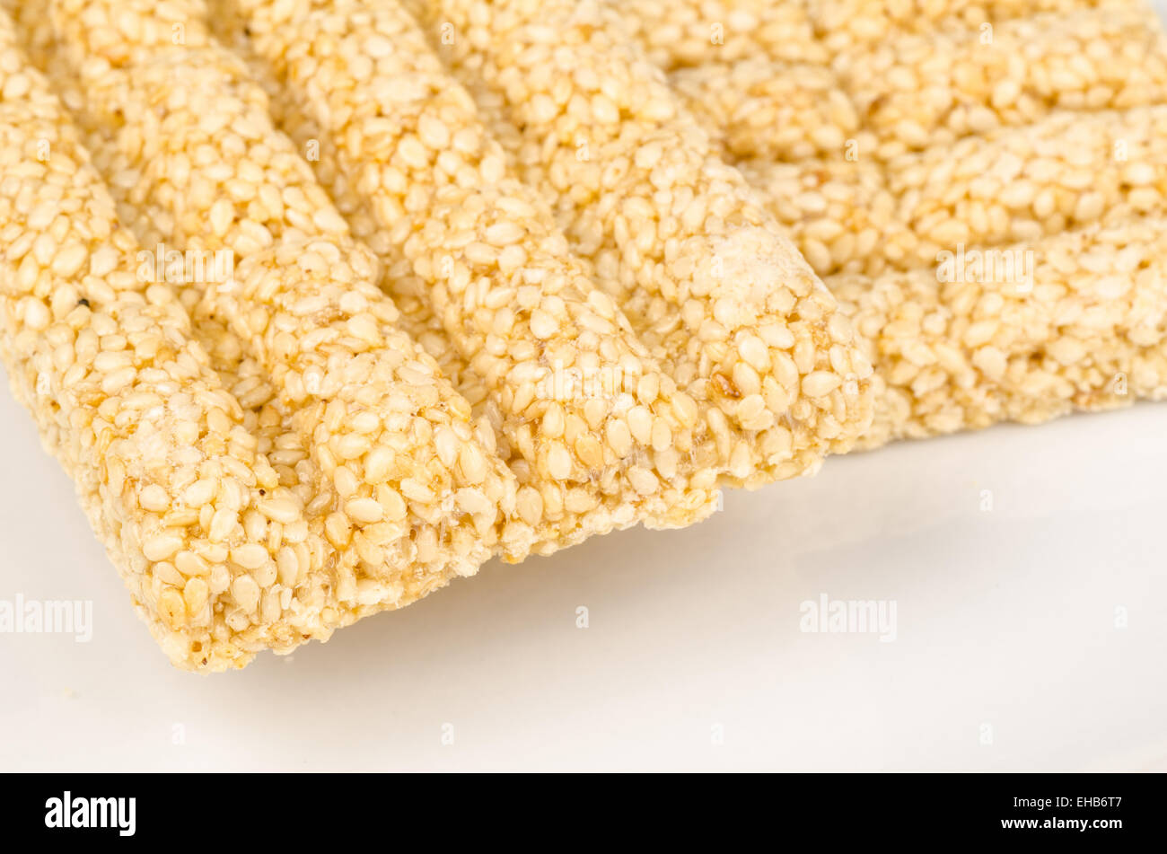 Closeup take of sesame bars isolated on white Stock Photo - Alamy