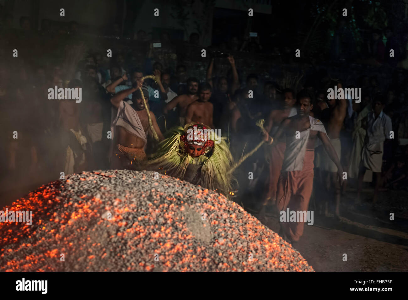 Fire walk of Theyyam Stock Photo - Alamy