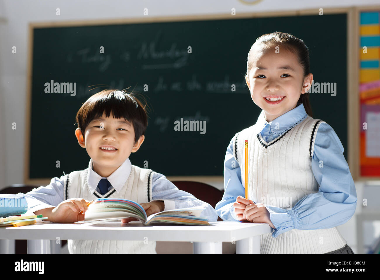 Elementary school students in the classroom Stock Photo - Alamy