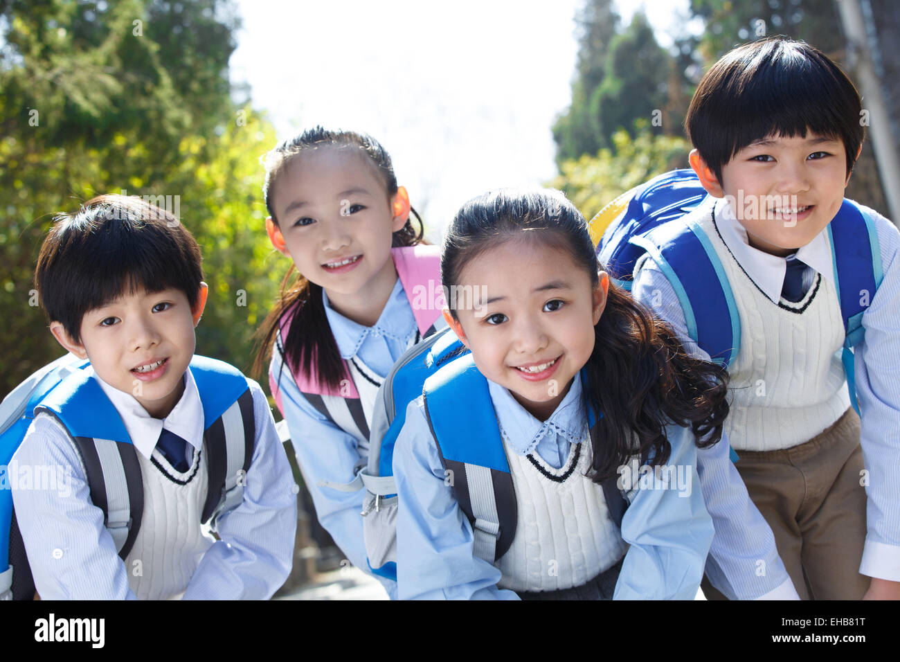 Children back to back standing hi-res stock photography and images - Alamy