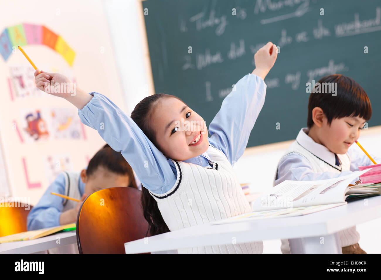 Elementary school students in class Stock Photo - Alamy