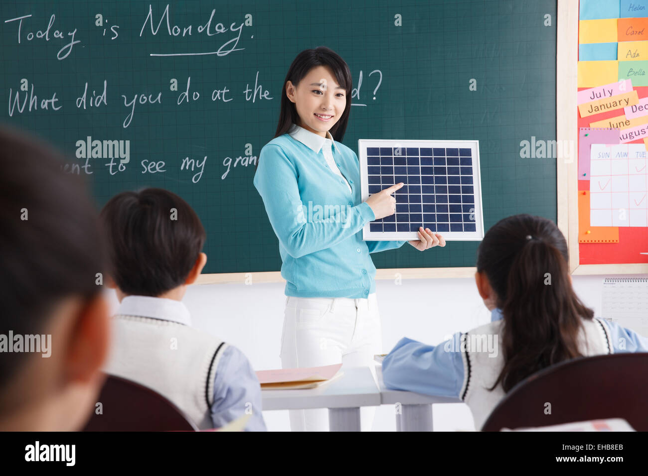 Elementary school students and teachers in class Stock Photo - Alamy