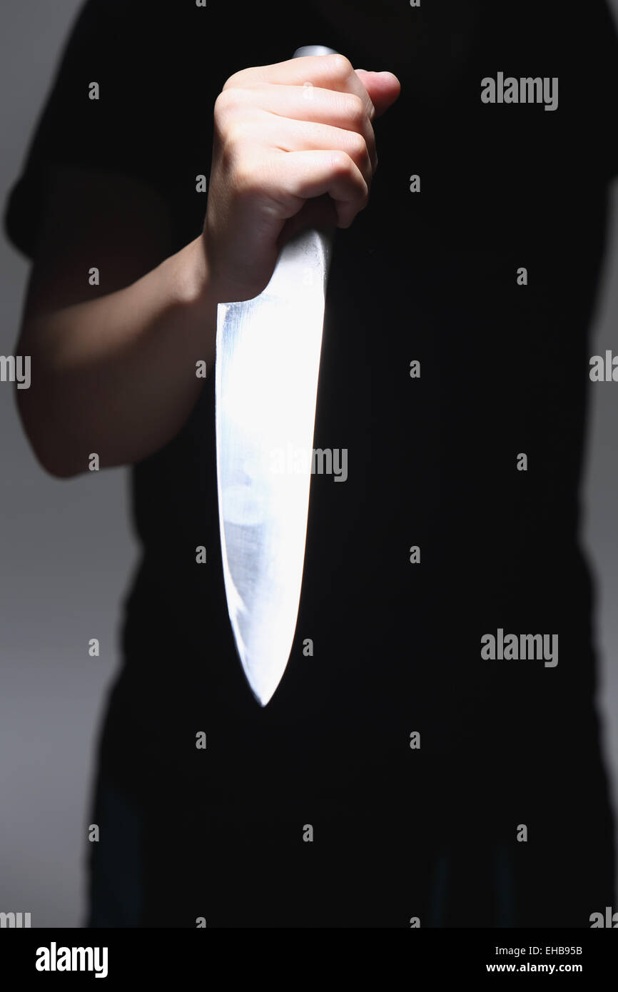 Silhouette man holding sharp knife hi-res stock photography and images ...