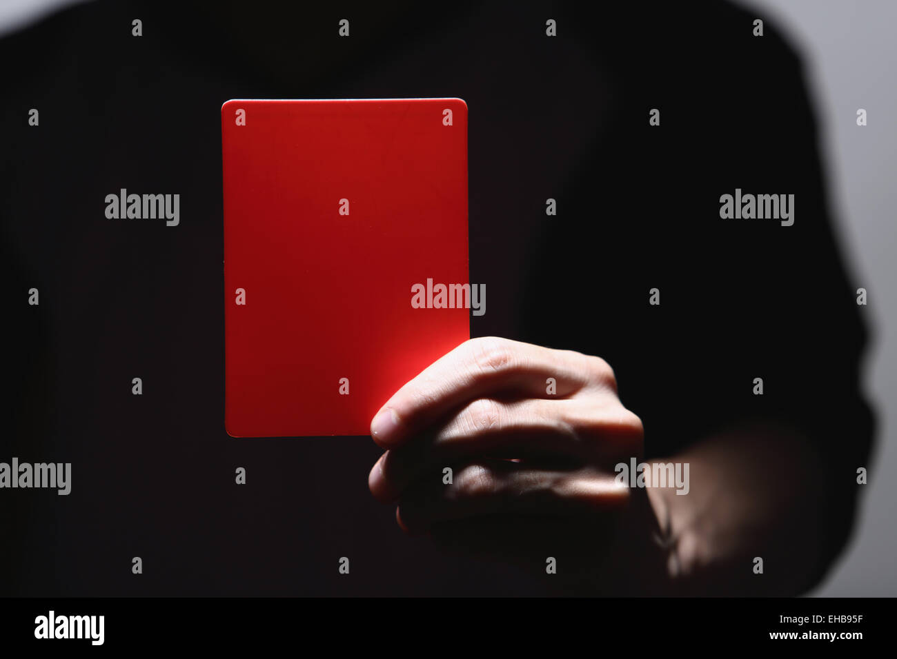 Man holding red card Stock Photo - Alamy