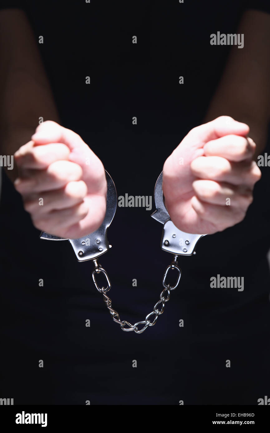 Handcuffed arms hi-res stock photography and images - Alamy