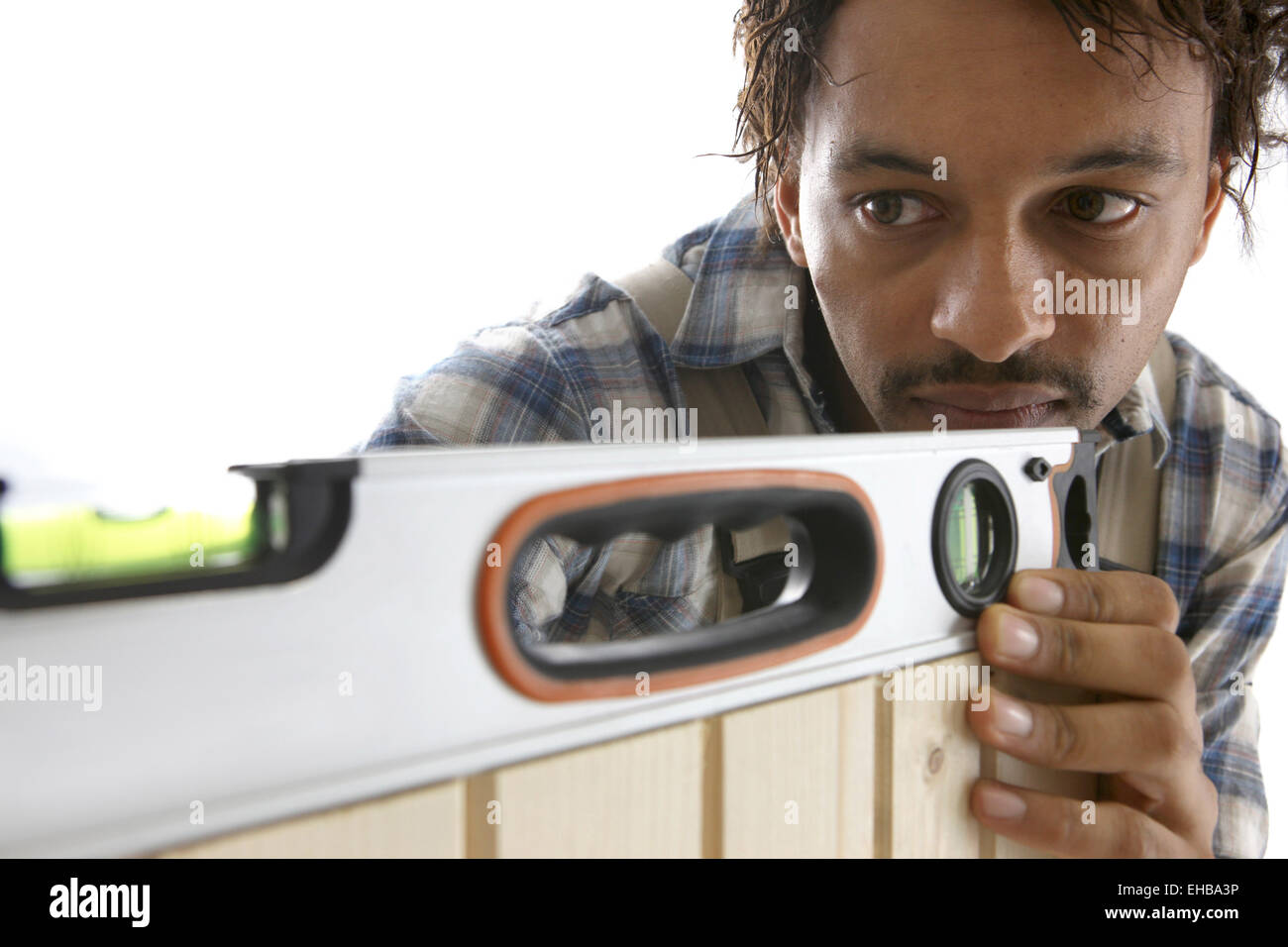 Carpenter using spirit-level Stock Photo - Alamy
