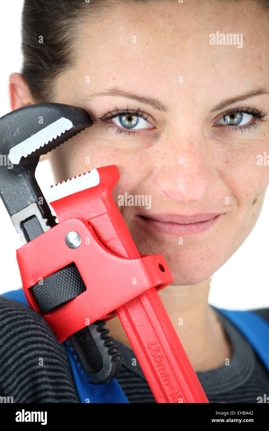 Woman holding adjustable wrench Stock Photo - Alamy