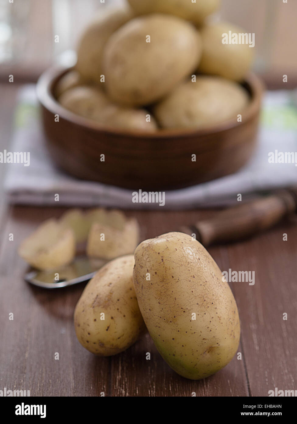 Raw potatoes on a tray Stock Photo - Alamy