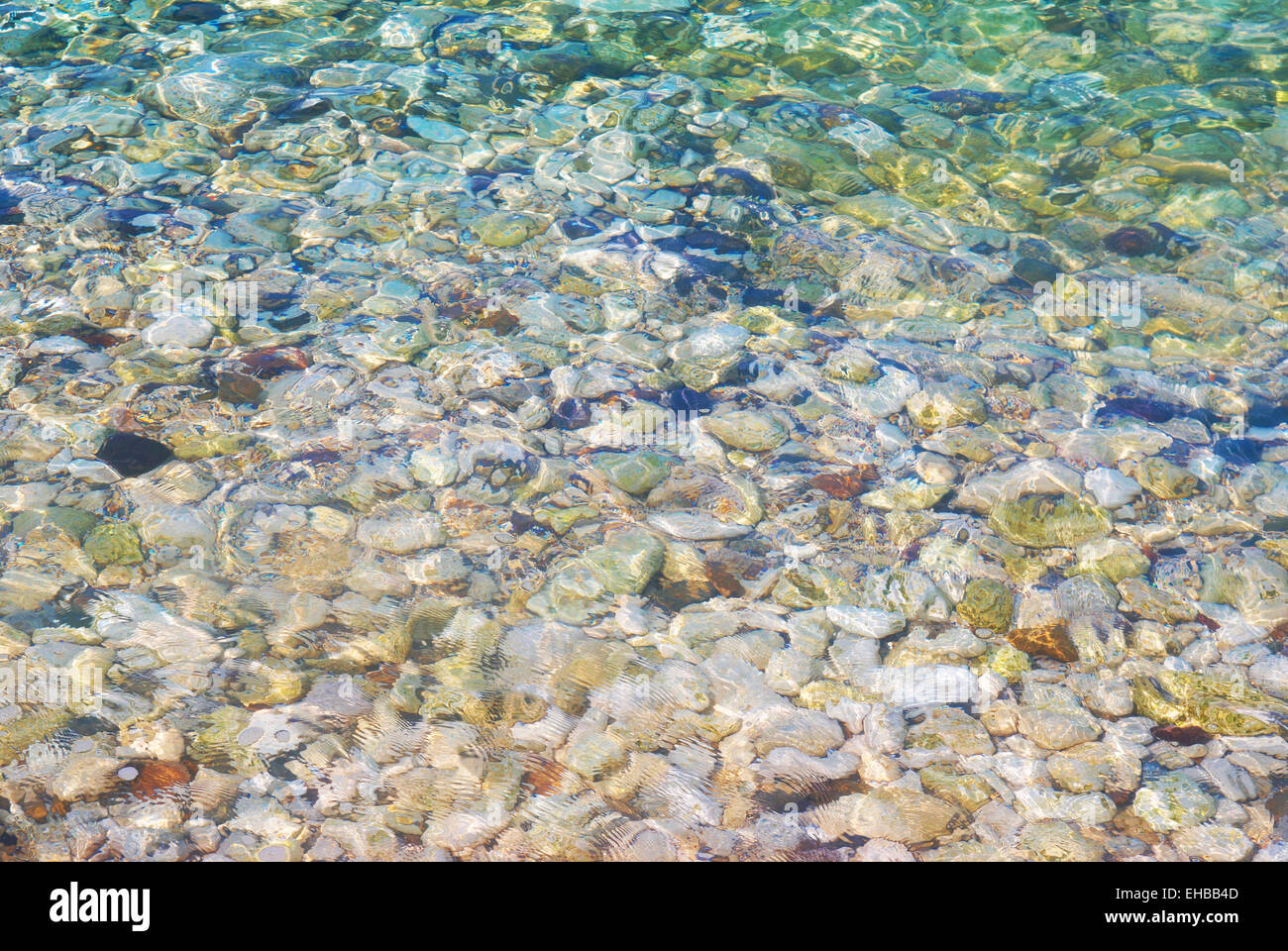 Blue tropical water with a sunlight reflections Stock Photo - Alamy