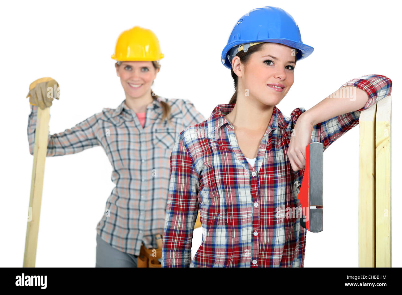 Female builders with wood Stock Photo - Alamy