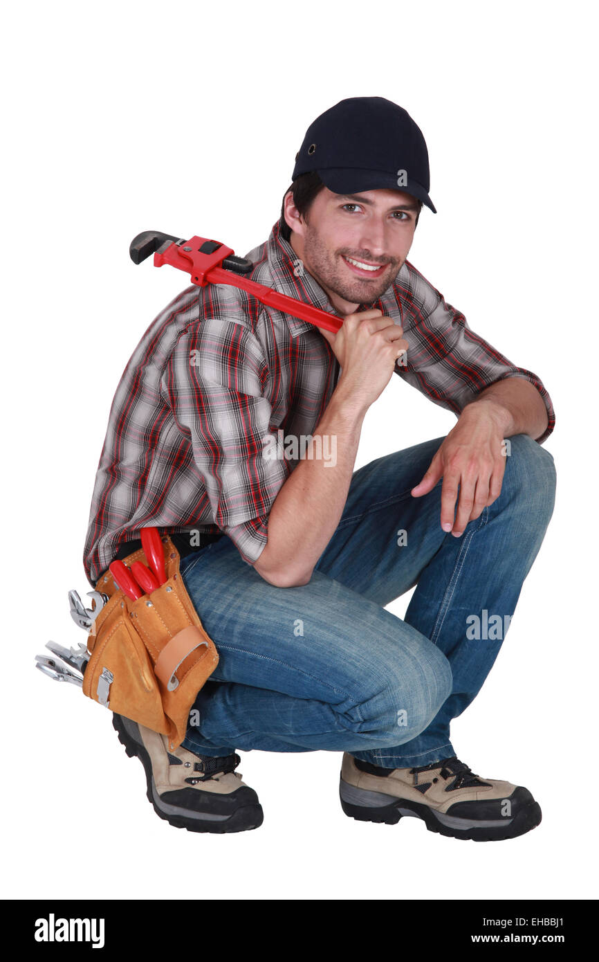 Handyman with a wrench Stock Photo - Alamy