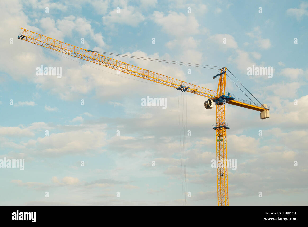 Building crane with blue sky background Stock Photo - Alamy