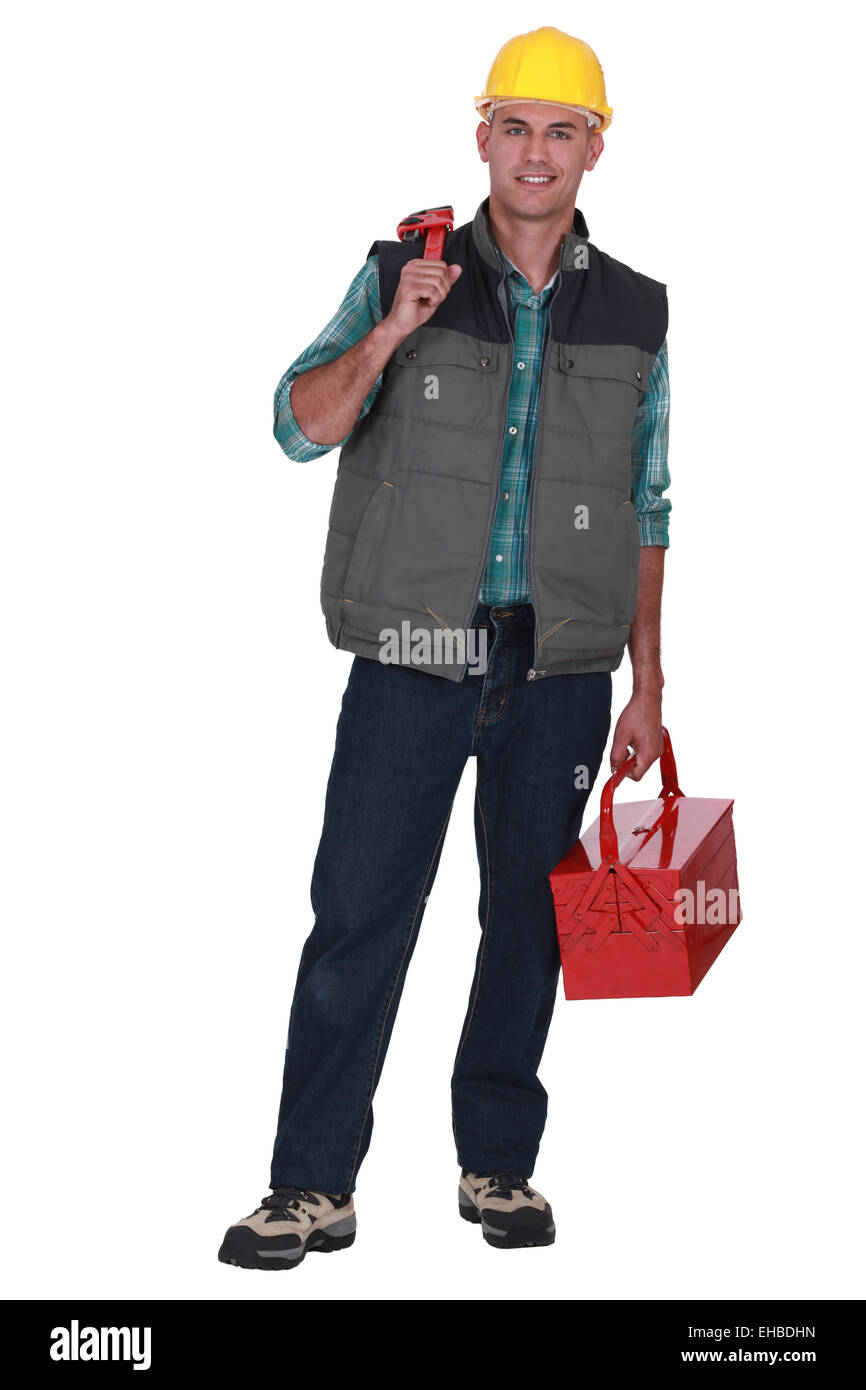 Man holding wrench and tool-box Stock Photo - Alamy