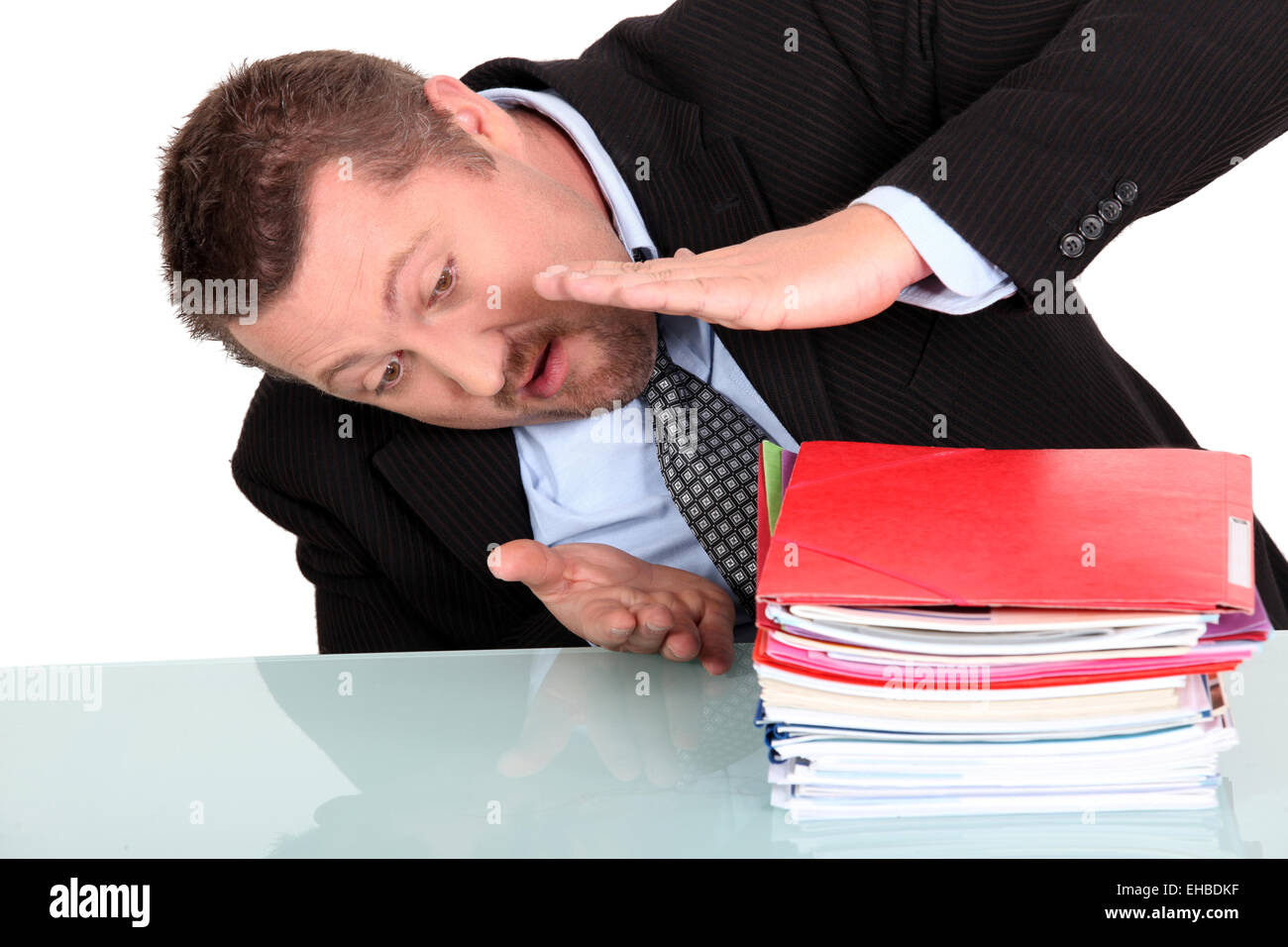 Businessmanwith pile of work Stock Photo - Alamy