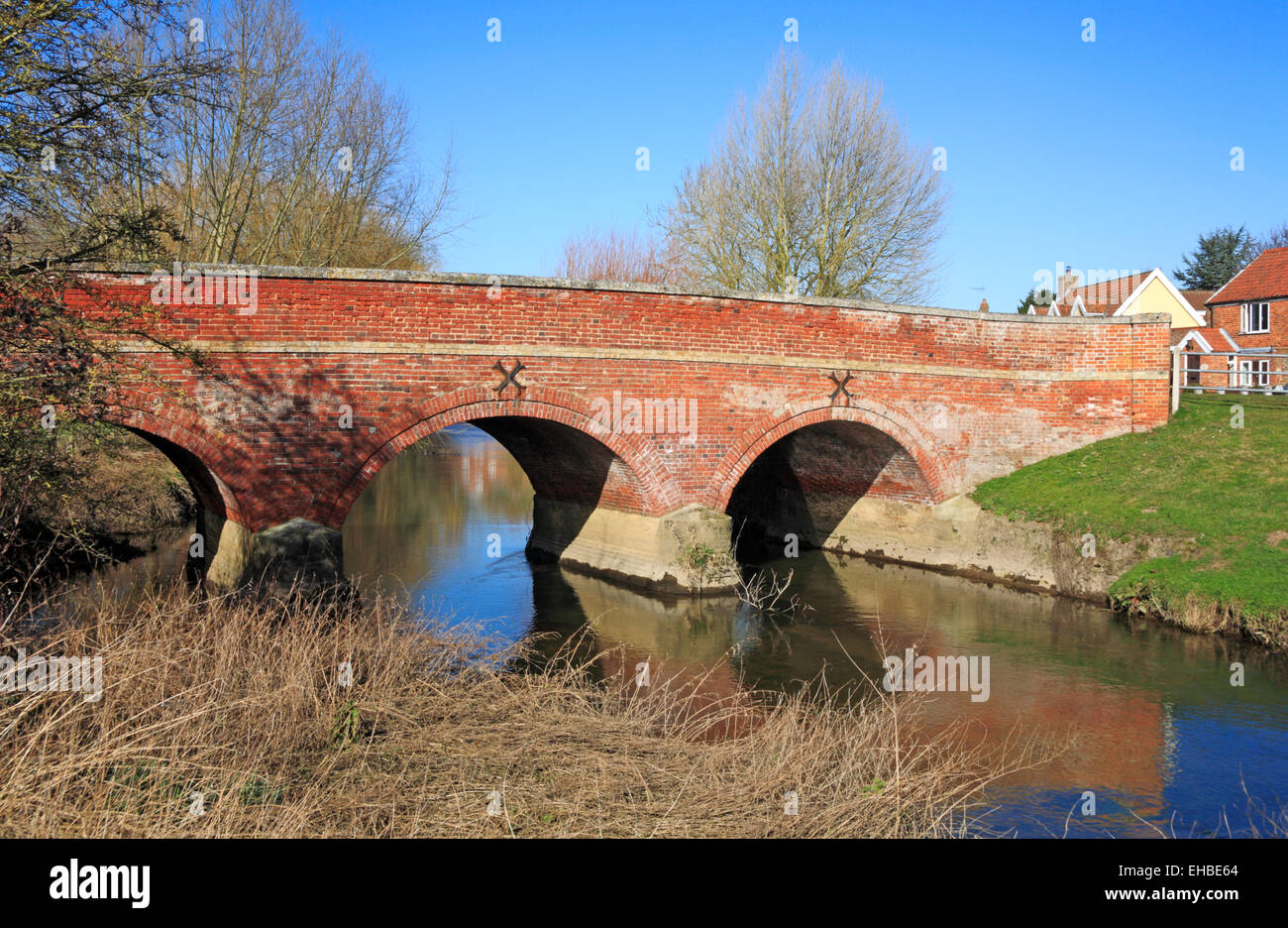 A view of the old brick bridge over the River Yare at Bawburgh, Norfolk ...