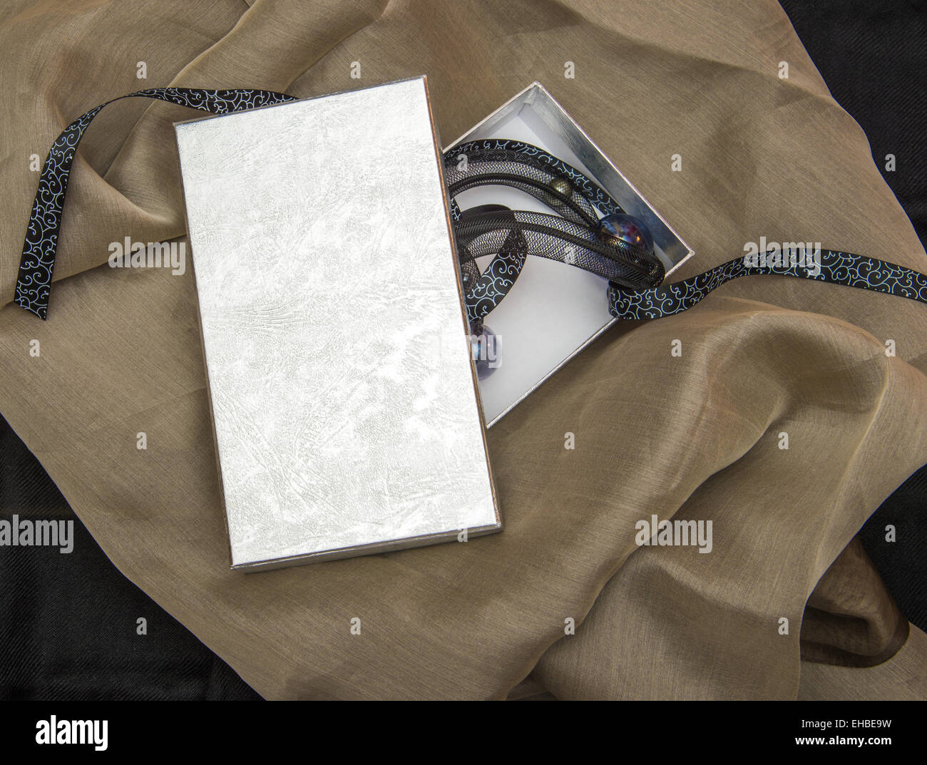 the surprise gift box on the fabric Stock Photo - Alamy
