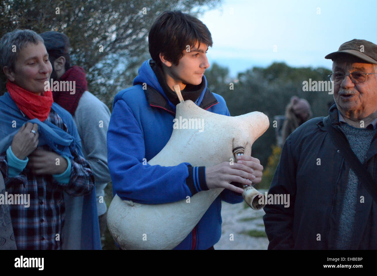 A young musician plays on top of FIlopapou hill oposite Acropolis.Greek ...