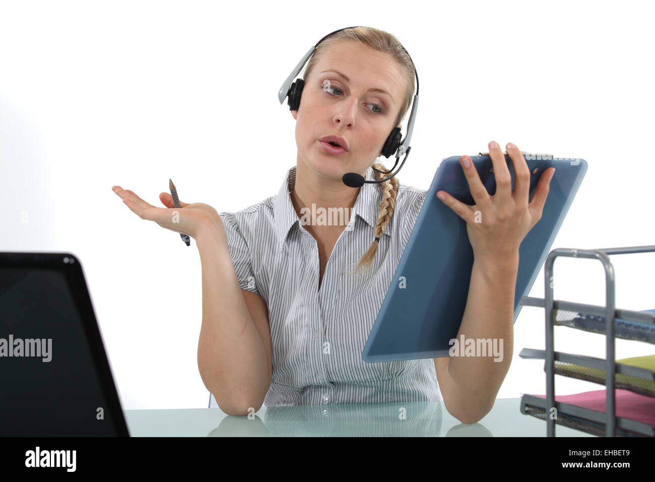 Blond receptionist wearing head-set Stock Photo - Alamy