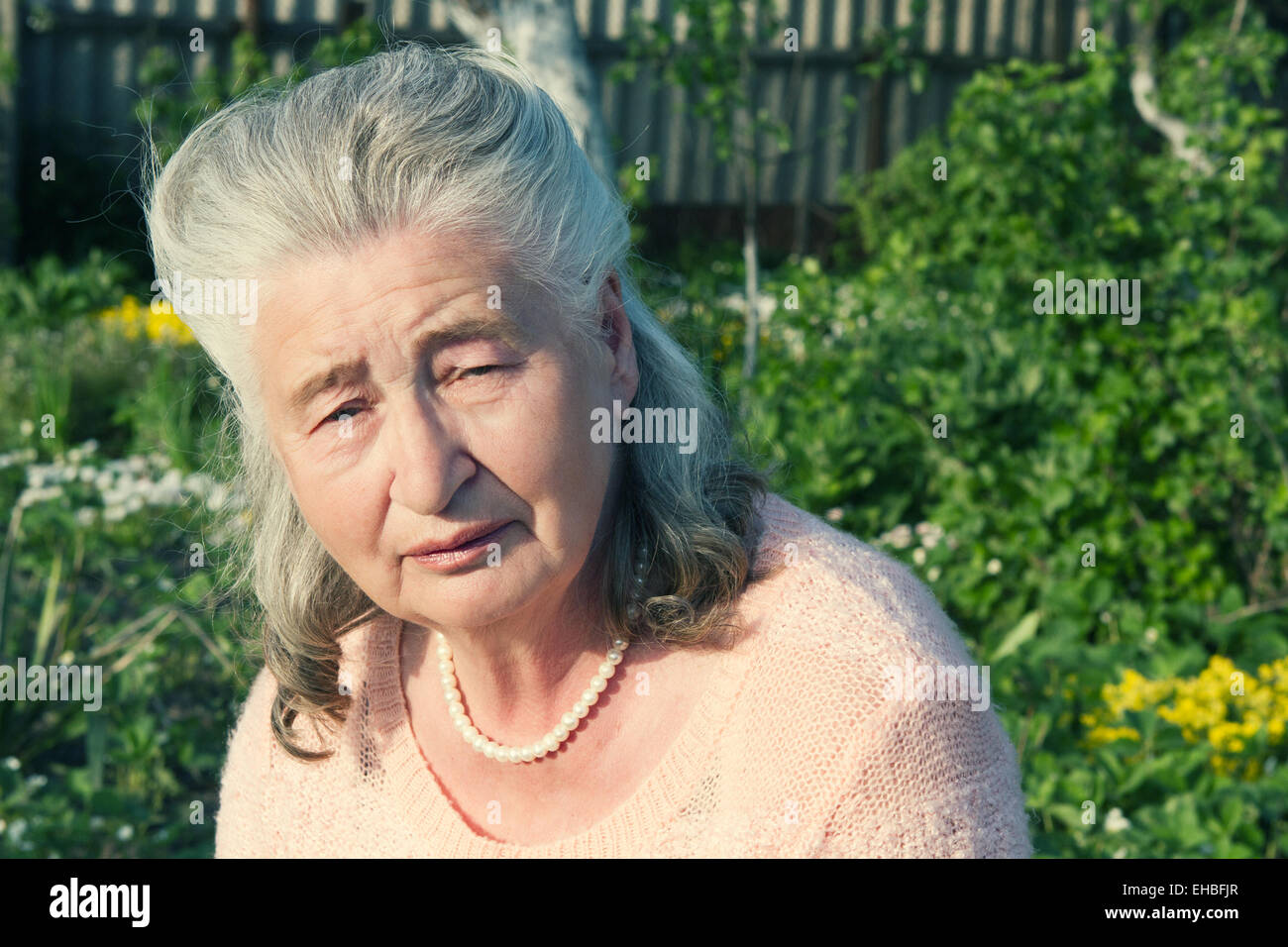 Older woman walking spring hi-res stock photography and images - Alamy