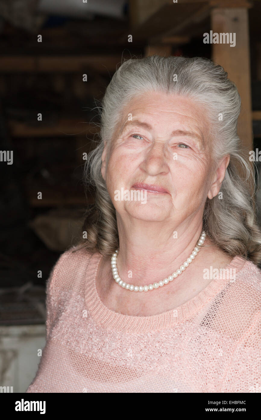 Older woman walking spring hi-res stock photography and images - Alamy