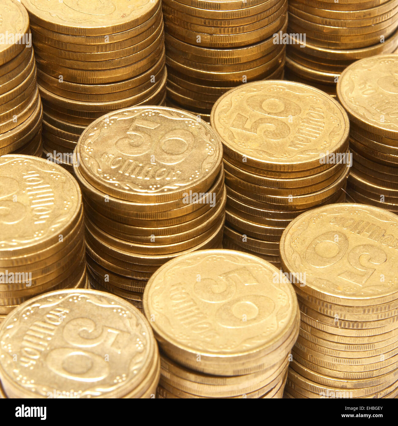 Stack of golden coins isolated on white Stock Photo - Alamy