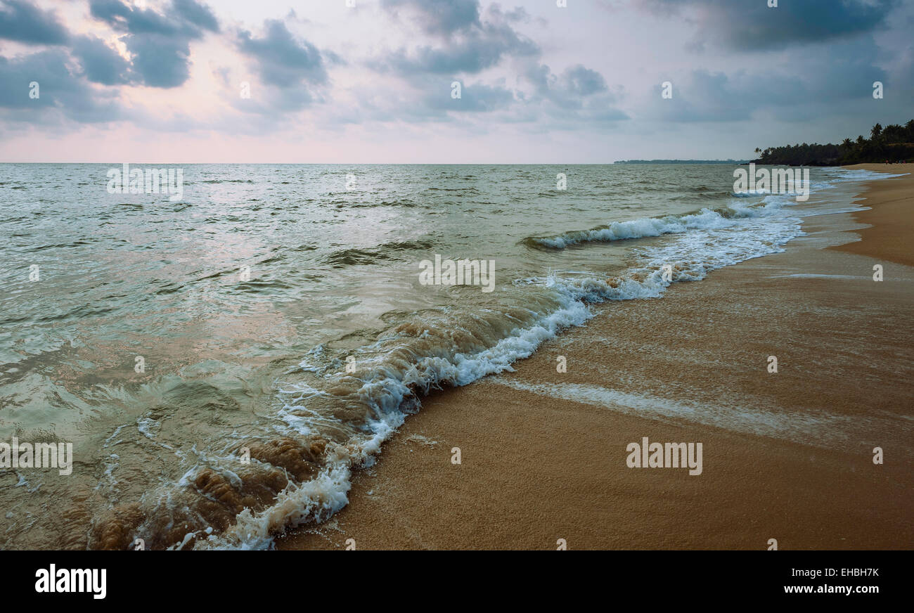 Sunset over the Arabian Sea with a glimpse of Thottada beach at low ...