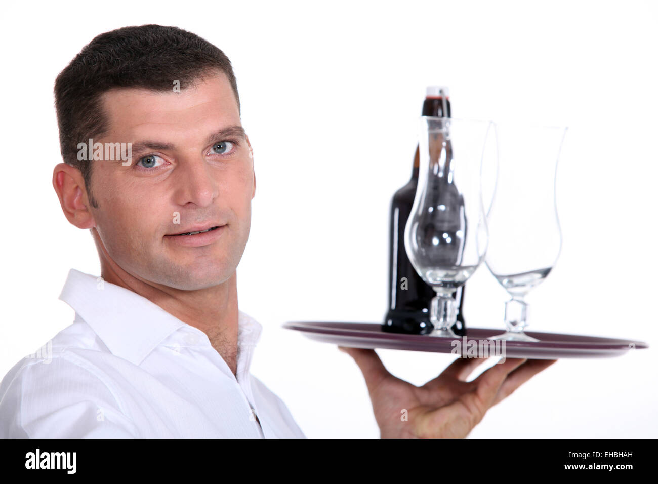 Waiter serving a beer Stock Photo - Alamy