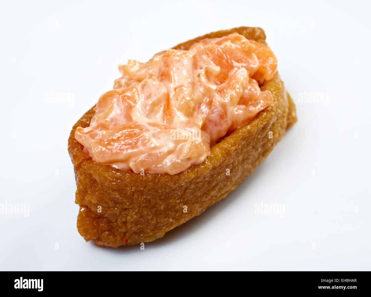 inari sushi with salmon and roe tobiko Stock Photo - Alamy