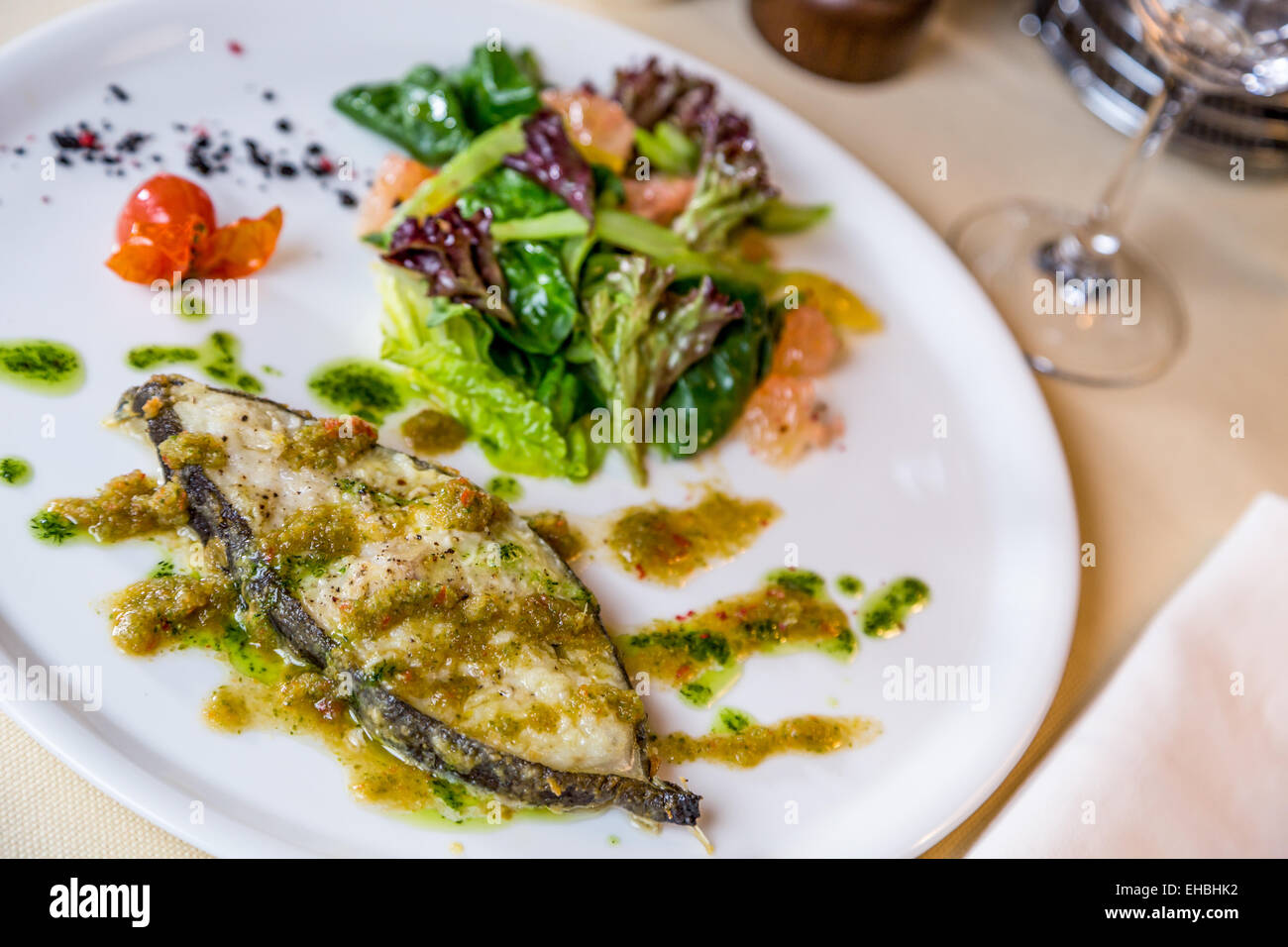 Restourant serving dish - roast slice fish on table Stock Photo - Alamy