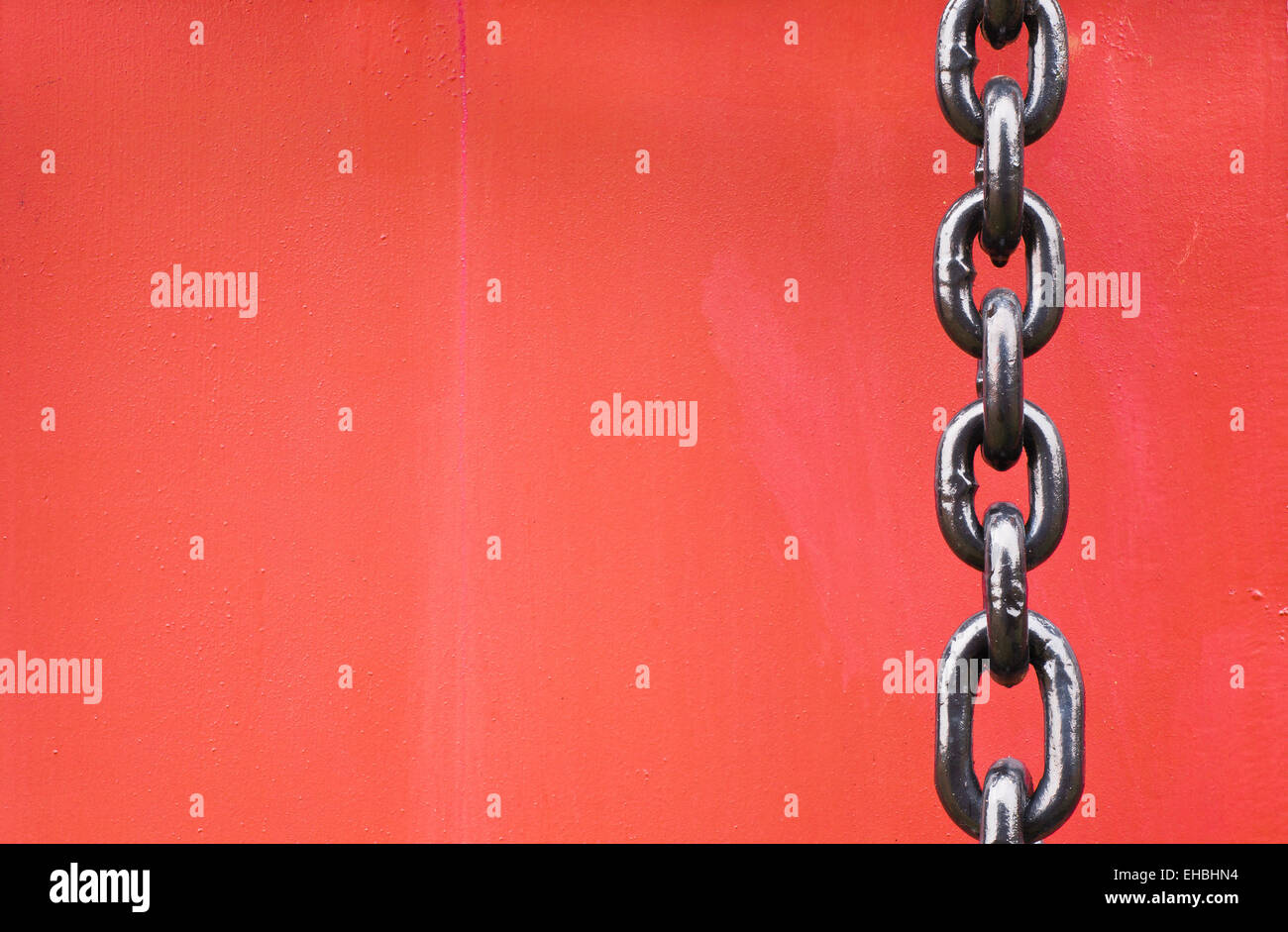 Black painted chain with grungy red metal background Stock Photo - Alamy