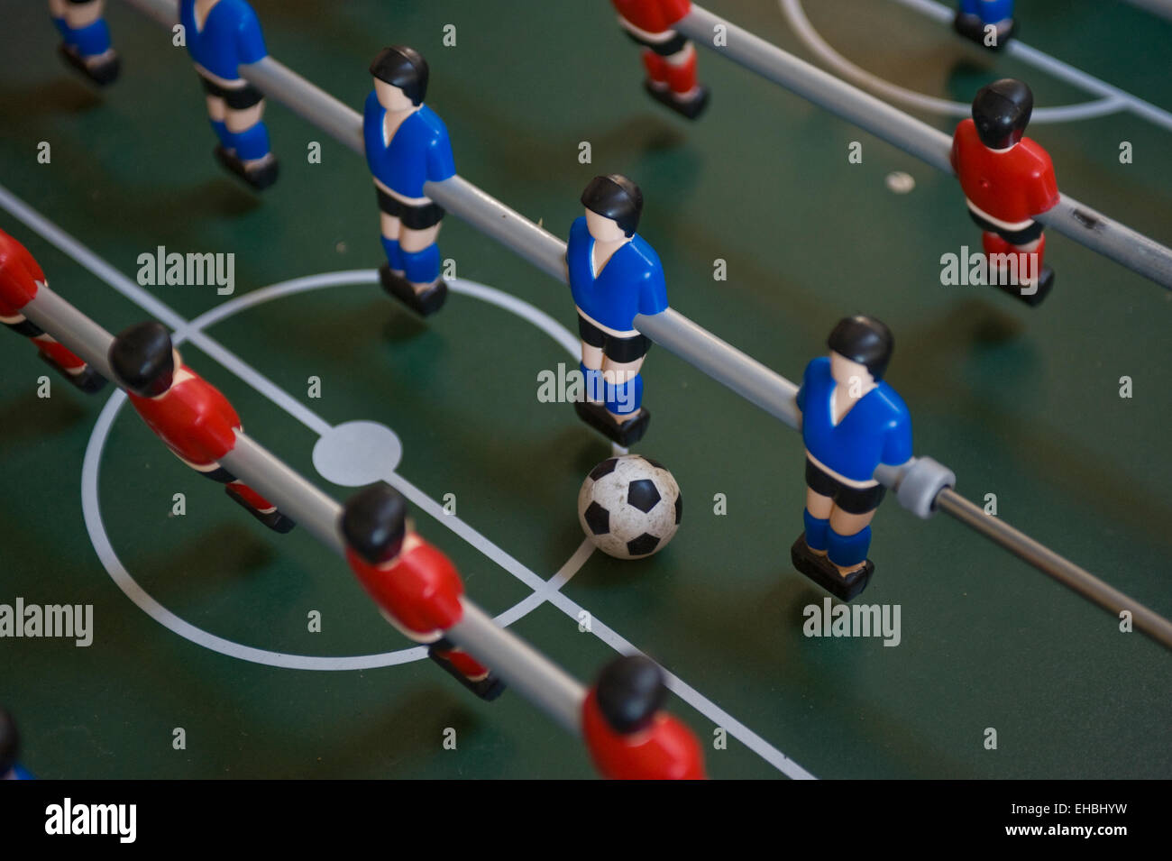 Red and Blue soccer players on table football figures on a foosball ...