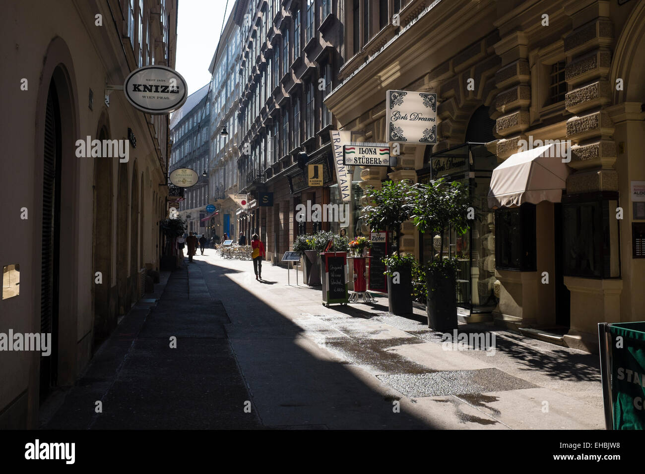 Inner City, Vienna, a street with shops in a sunny March afternoon ...