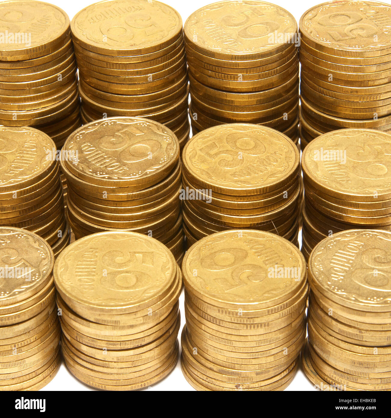 Stack of golden coins isolated on white Stock Photo - Alamy