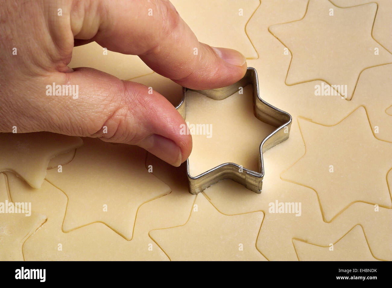 cookie dough is cut out by hand Stock Photo - Alamy