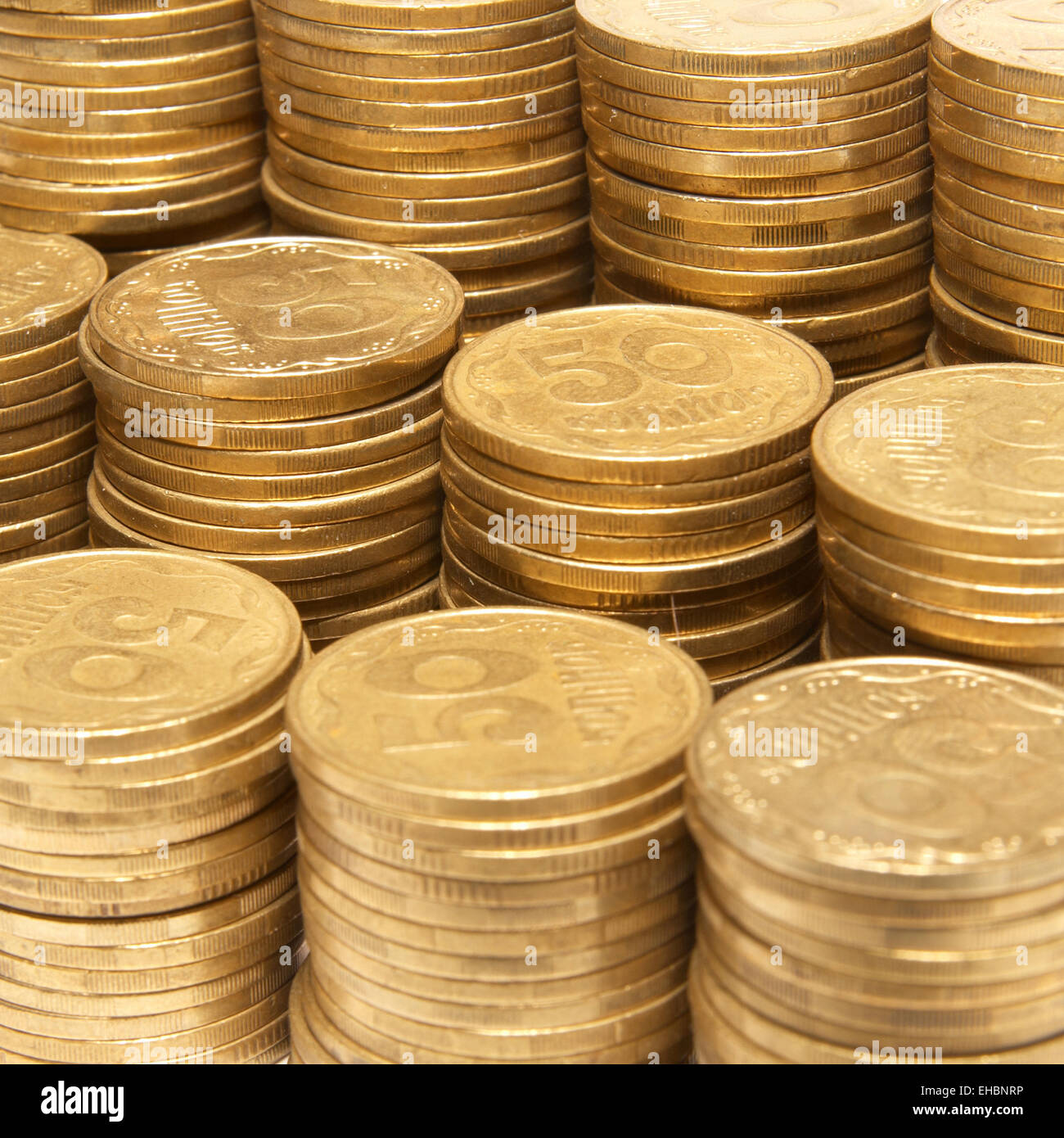 Stack of golden coins isolated on white Stock Photo - Alamy