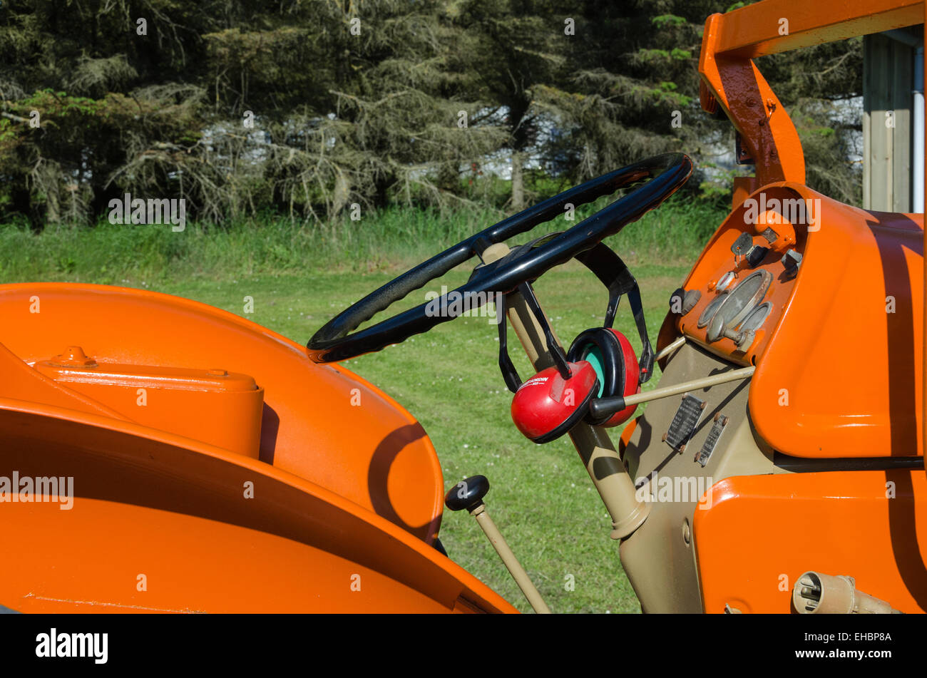 one orange old tractor Stock Photo - Alamy